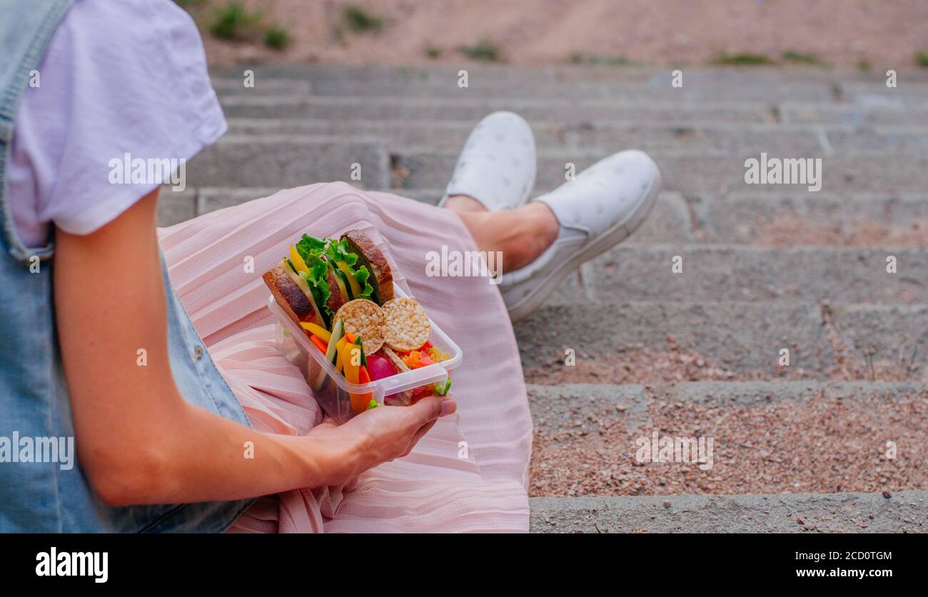 School girl eating lunch from lunchbox hi-res stock photography and ...
