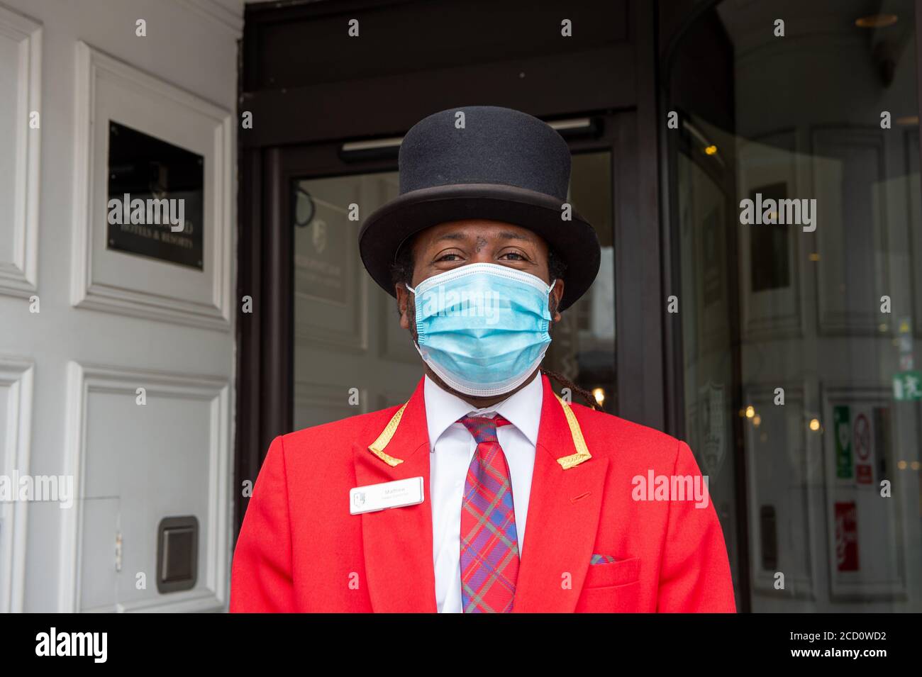 Hotel doorman with mask hi-res stock photography and images - Alamy