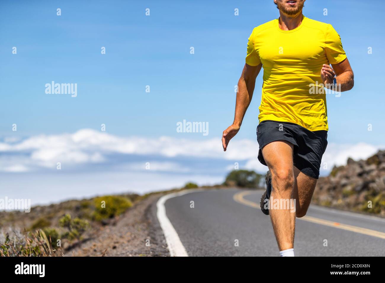Running man on outdoor road run runner in sports clothing sprinting in ...
