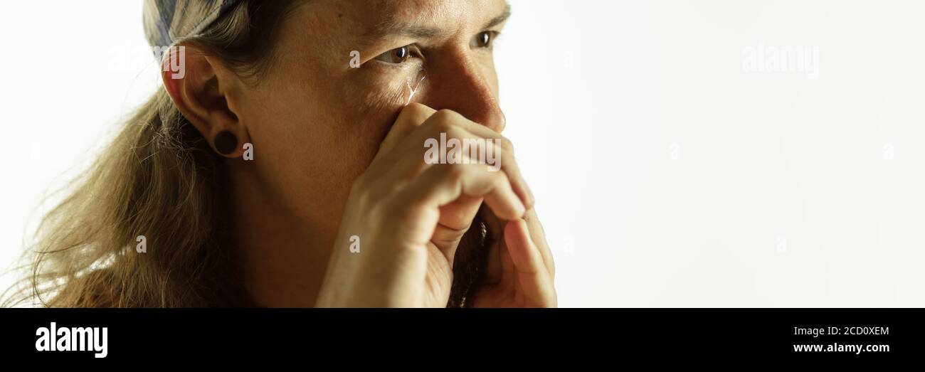 Crying. Caucasian young man's close up shot on studio background, flyer ...