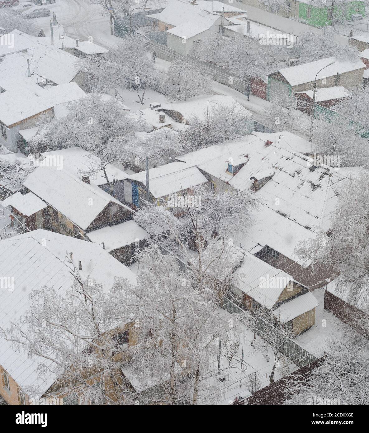 Aerail view of residential area and privat buildings in snowfall winter ...