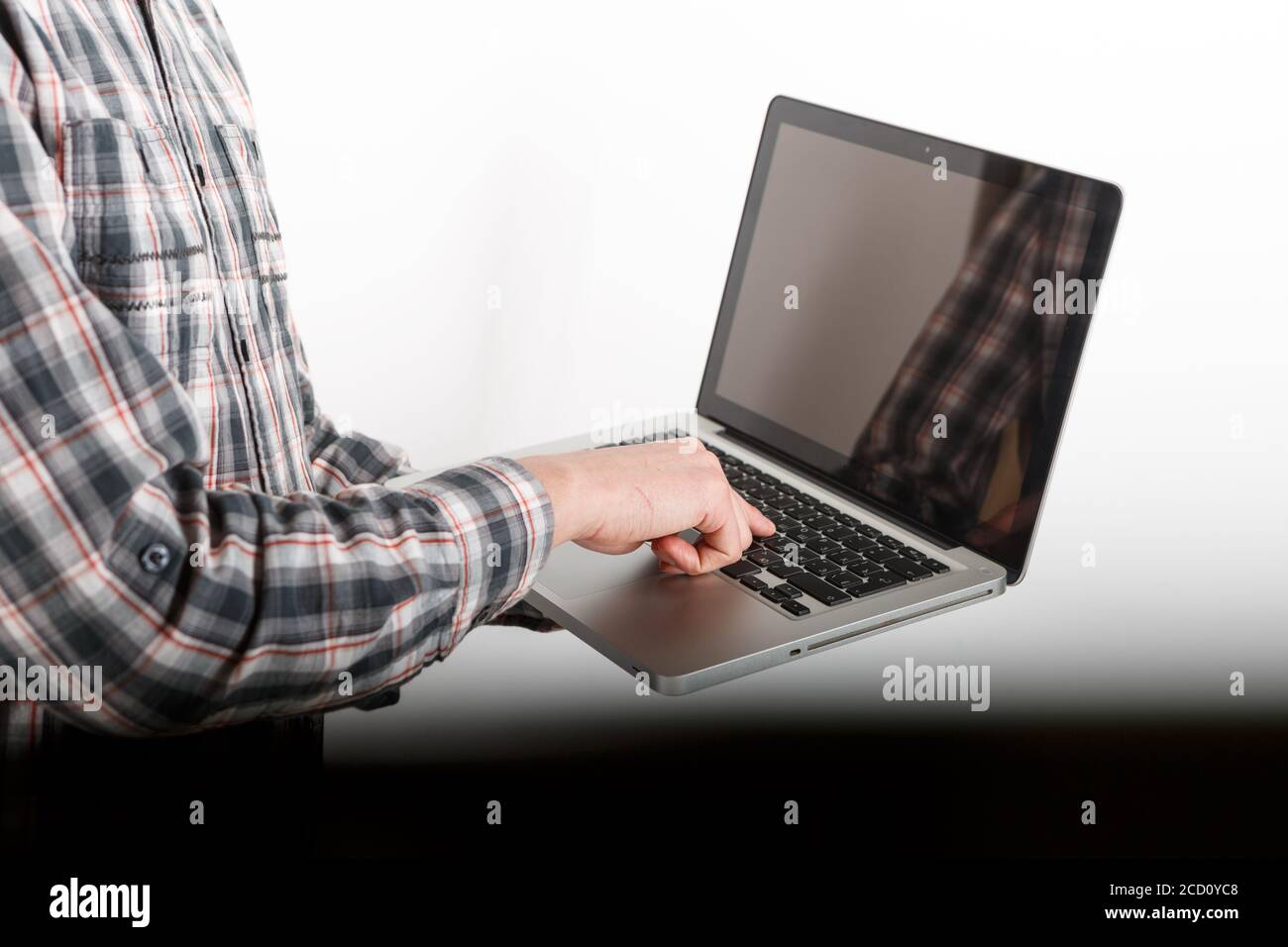 Laptop with man hand isolated on white background Stock Photo - Alamy