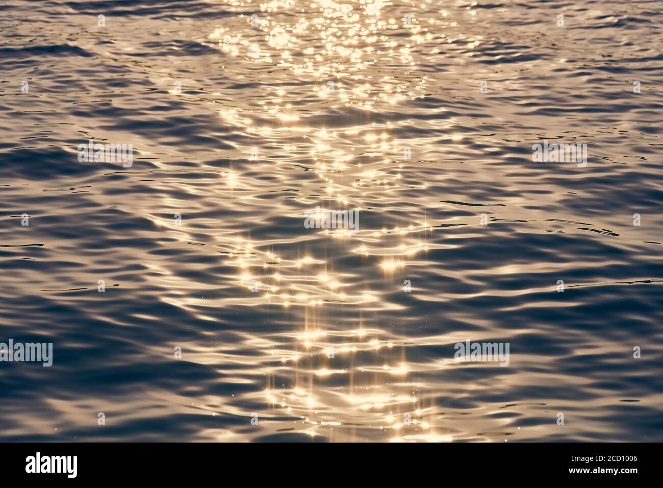 Ocean water texture in sunlight. Slight flow and light wind on water ...
