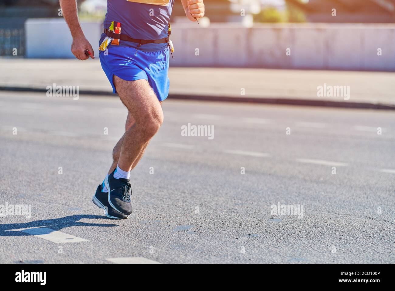 Running man. Athletic man jogging in sportswear on city road. Healthy ...