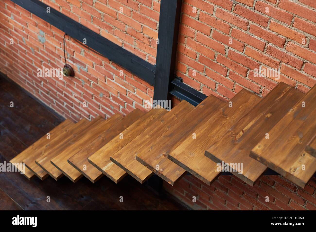 Stairs in loft apartment. Staircase without railing. Modern hipster ...