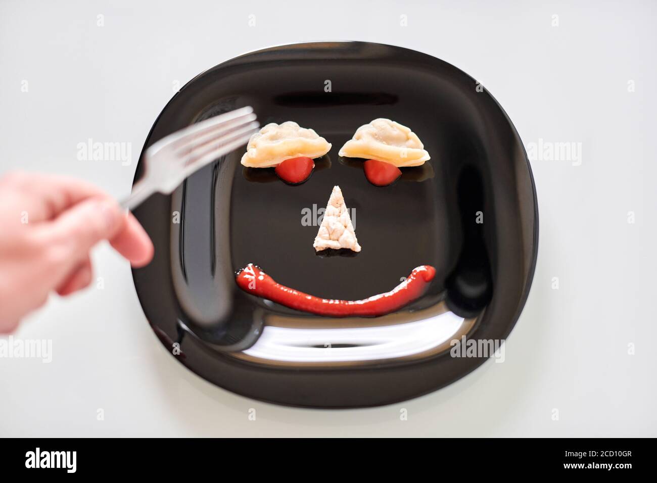 Food face, funny dumpling and ketchup. Smiling face on plate. Food art ...