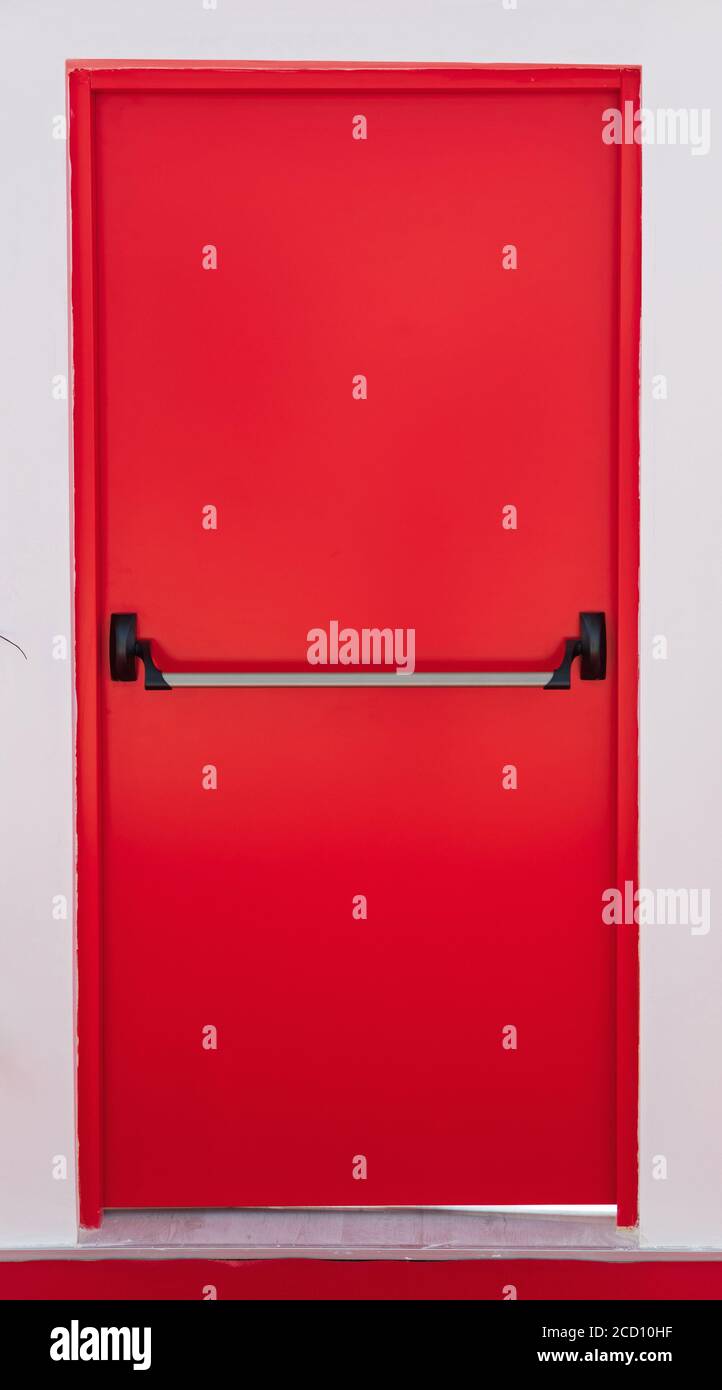 Red Fire Proof Safety Door With Handle Stock Photo - Alamy
