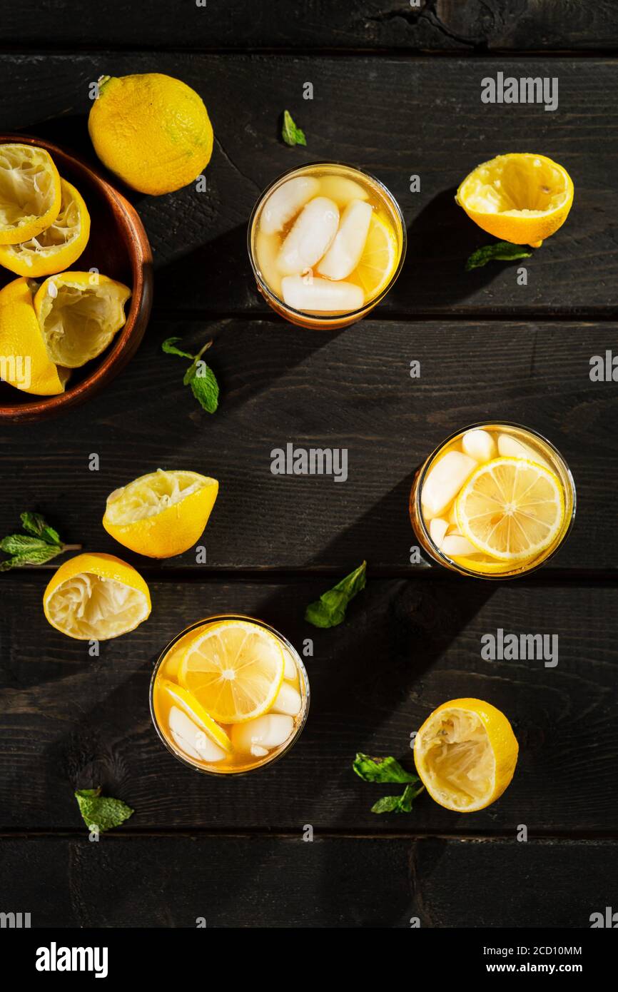 Lemon iced tea top view on dark background. A refreshing summer drink ...