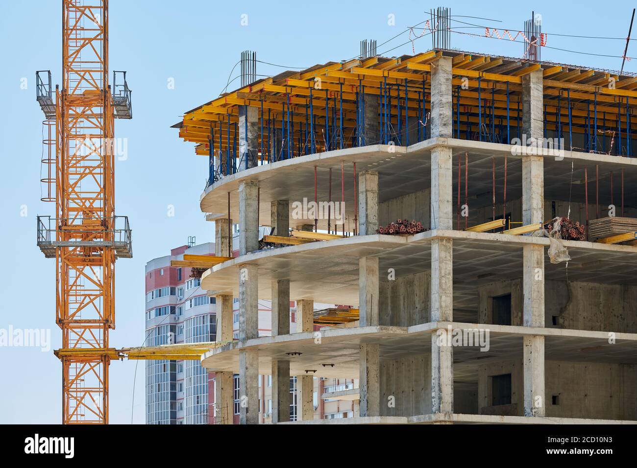 Scaffolding on construction site. Incomplete building and decoration ...
