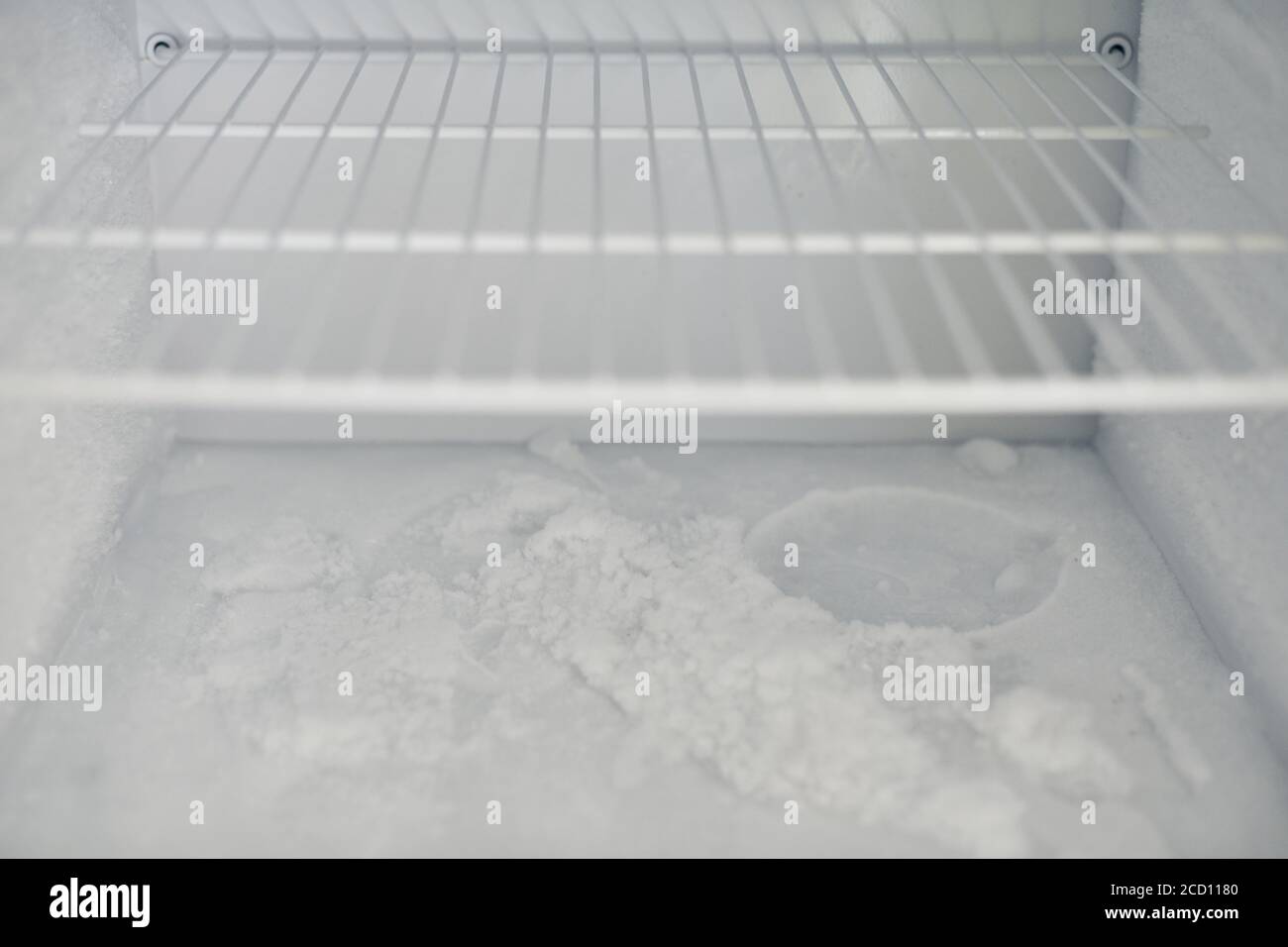 Ice buildup in freezer. Broken frozen refrigerator with built up ice ...