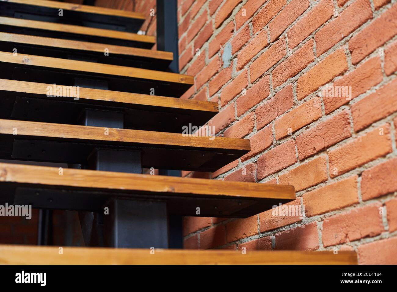 Stairs in loft apartment. Staircase without railing. Modern hipster ...