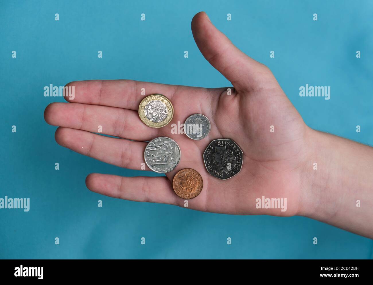 Hand copper coins uk hi-res stock photography and images - Alamy