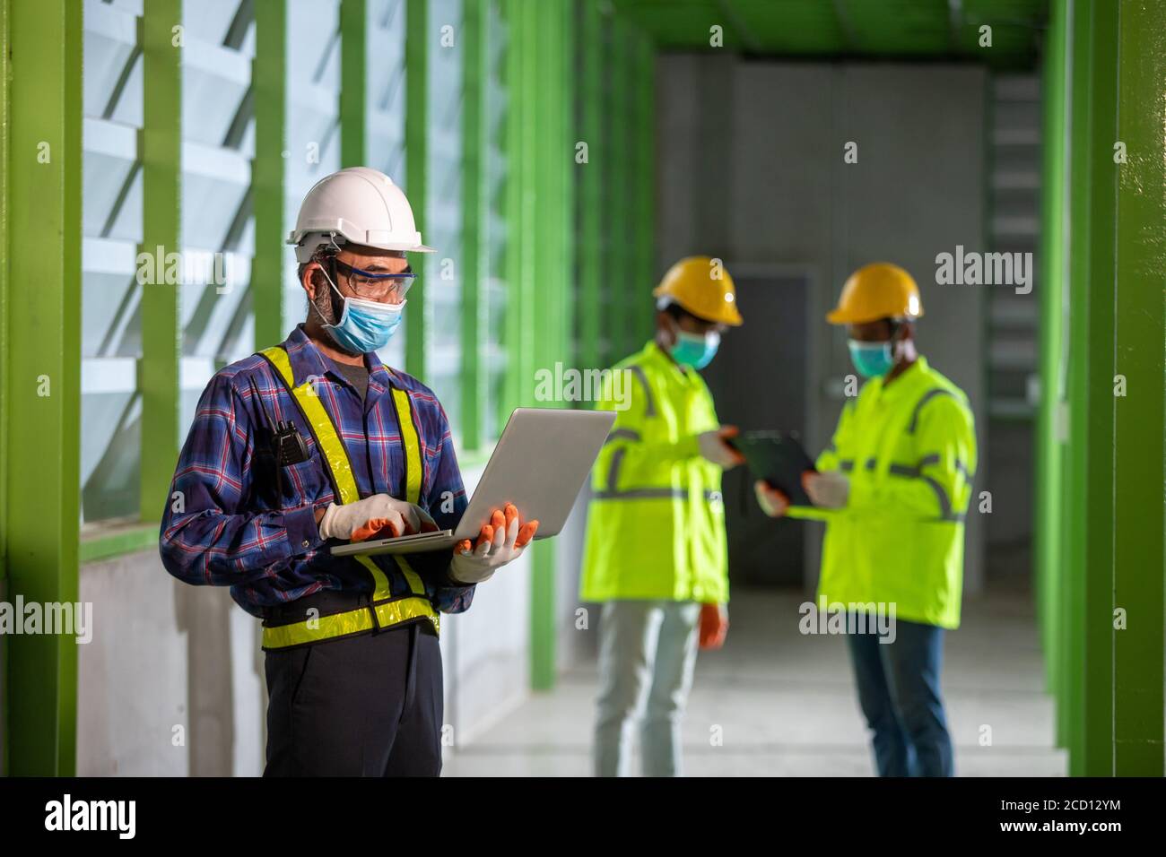 Asian worker under inspection and checking production process on ...