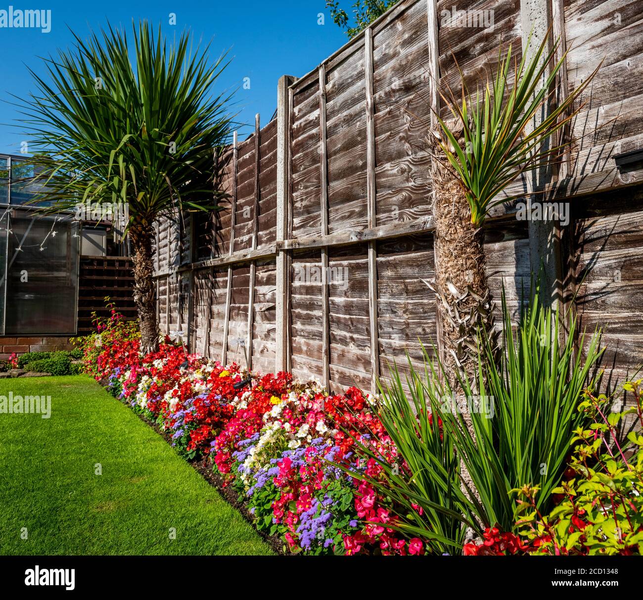 Colourful flower beds in a UK domestic garden Stock Photo - Alamy