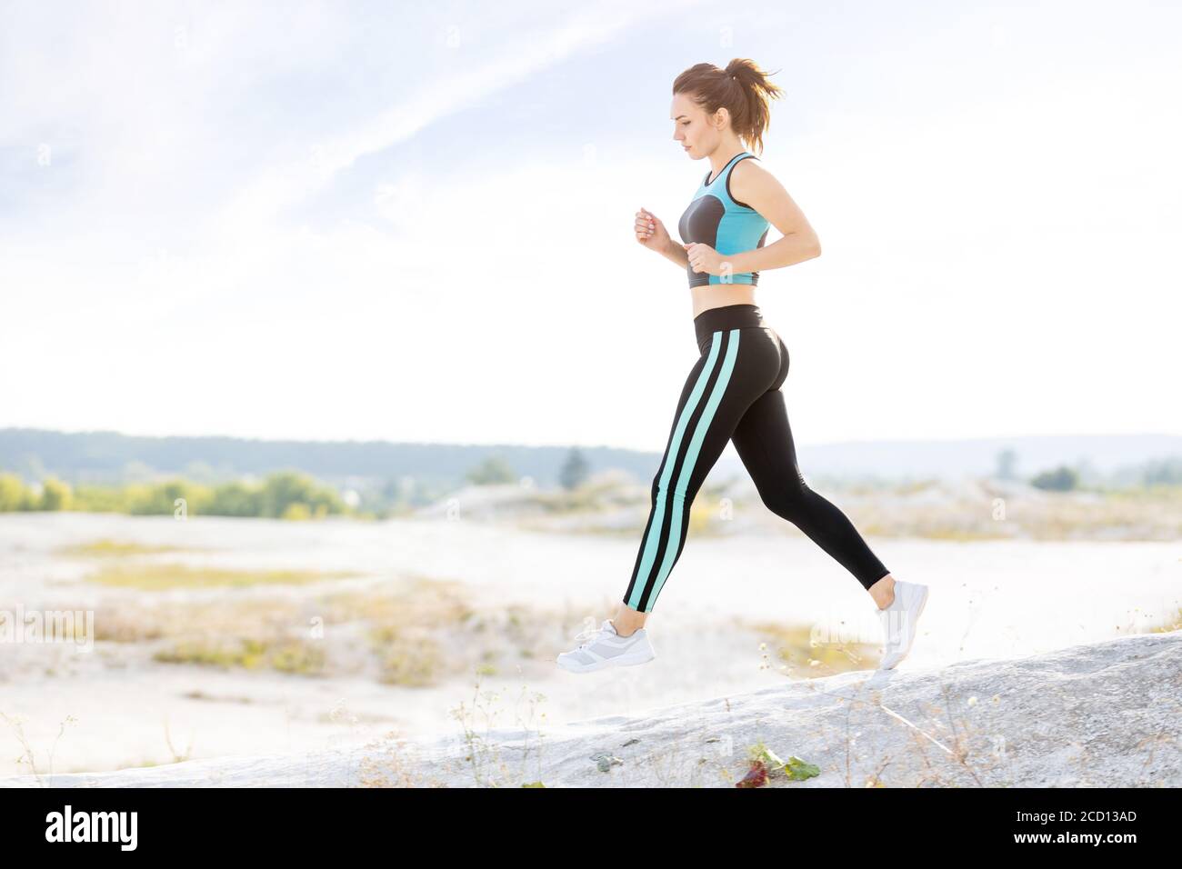 Girl jogging outdoors hi-res stock photography and images - Alamy