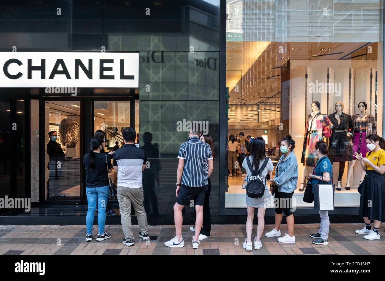 Hong Kong, China. 22nd Aug, 2020. Customers queue in line to enter the ...