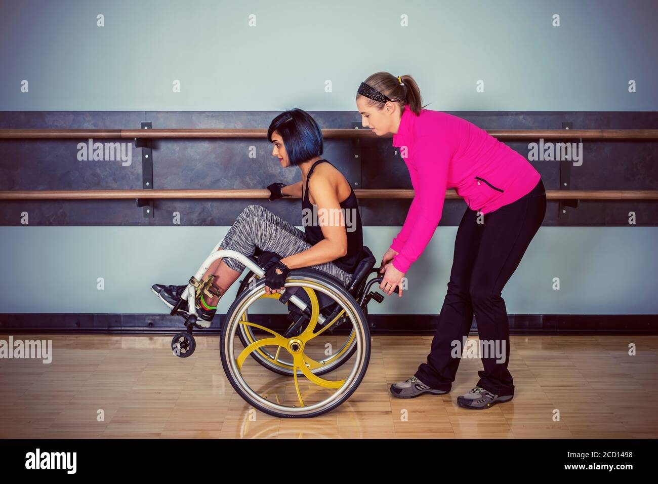 A paraplegic woman popping wheelie in her wheelchair and fooling around ...