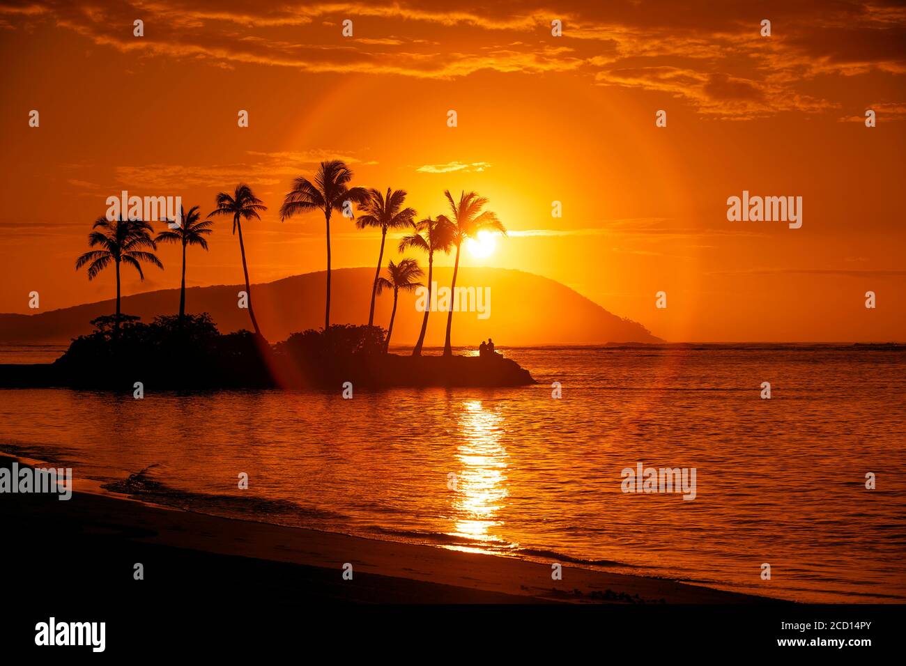Sunrise at Kahala Beach, Waiʻalae Beach Park, with a flare around the ...