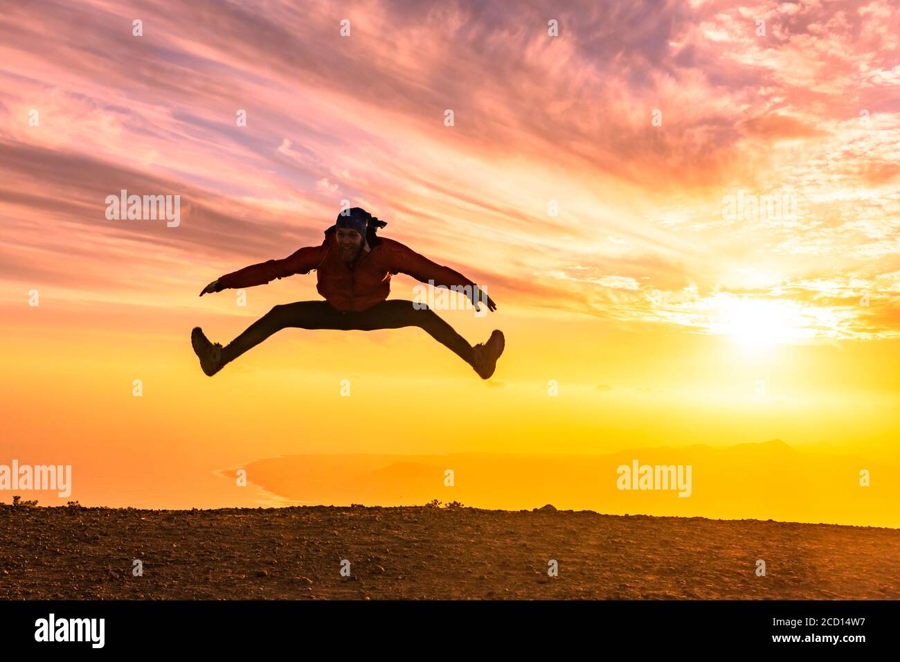 Happy man jumping for joy at sunset. Success, winner, happiness, ttavel ...