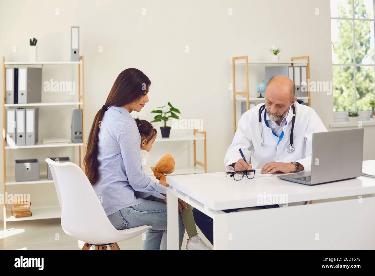 Family doctor appointment. Woman and little girl visiting pediatrician ...