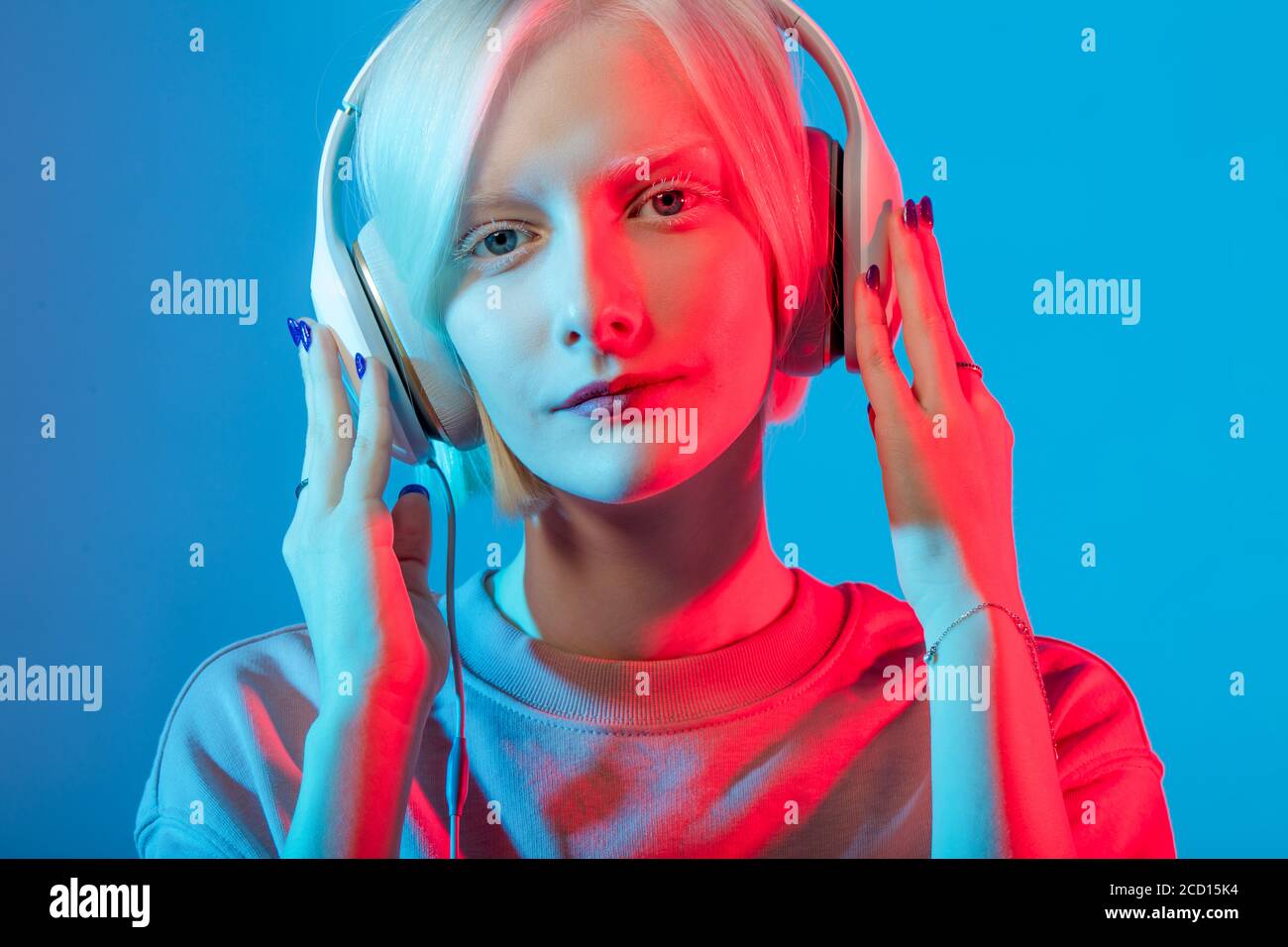 awesome Caucasian albino girl concentrated on music, close up photo ...