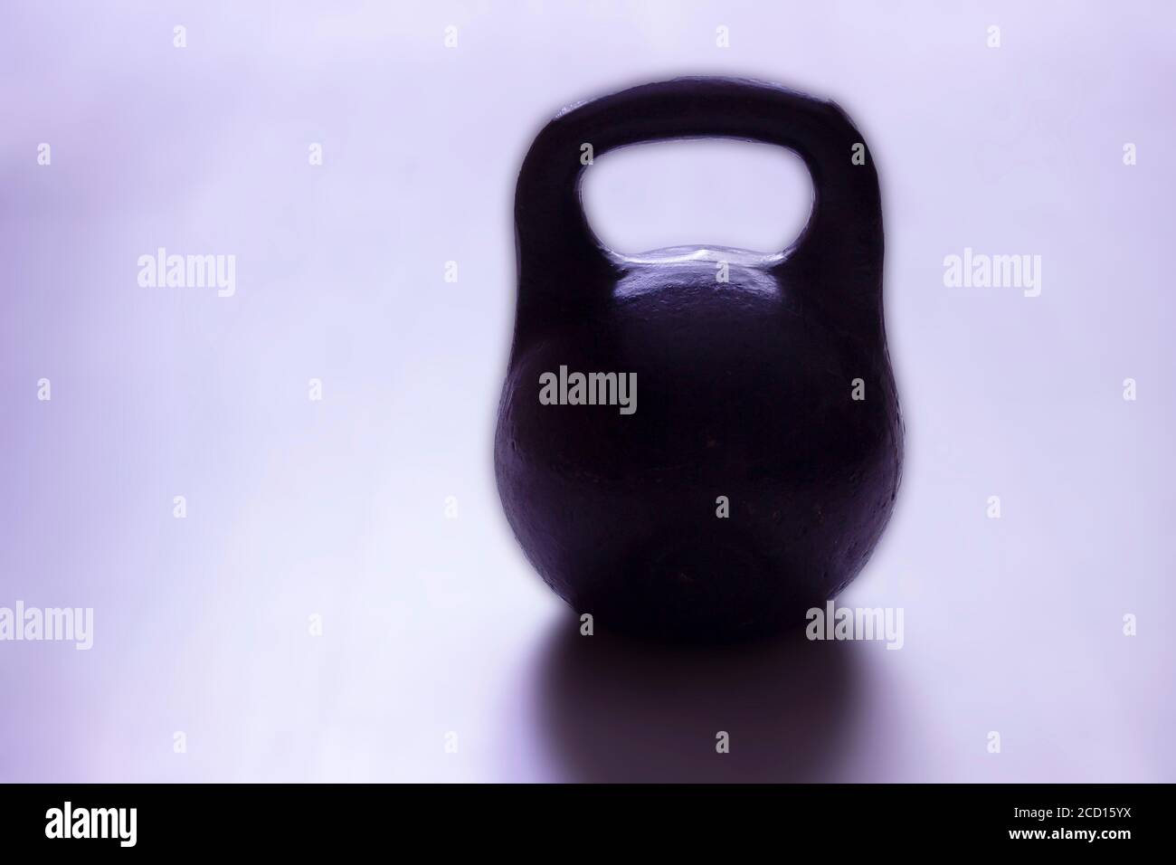 Cast-iron two-pound weight on a blurred background copy space Stock ...