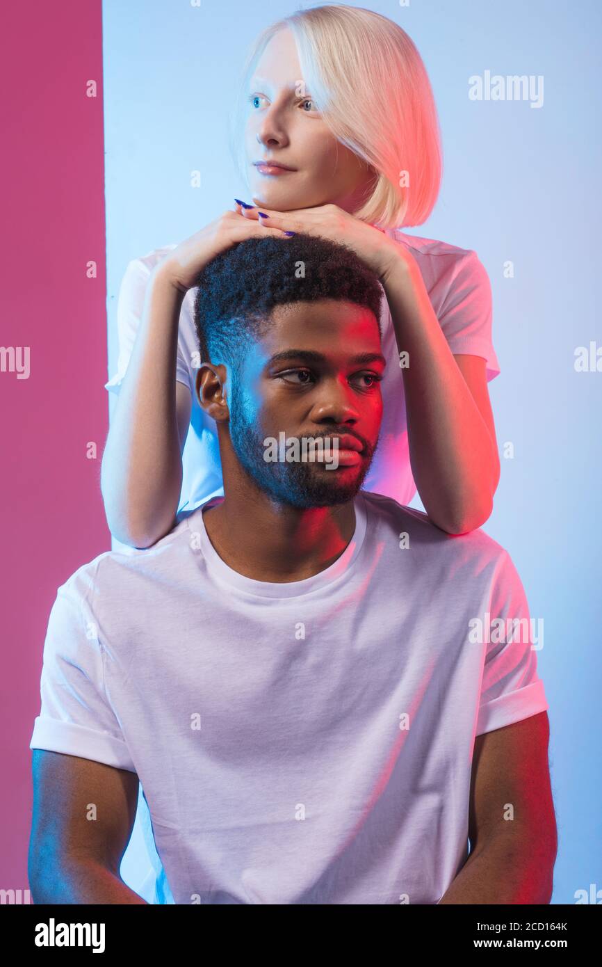 mixed race young people looking at different sides, close up photo ...