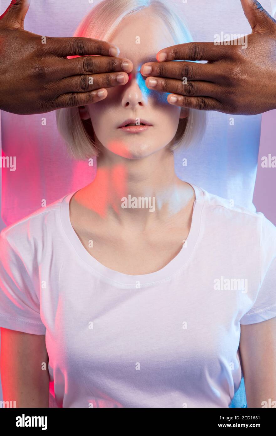 african man treating a young woman with a pale face, illlness, guy ...