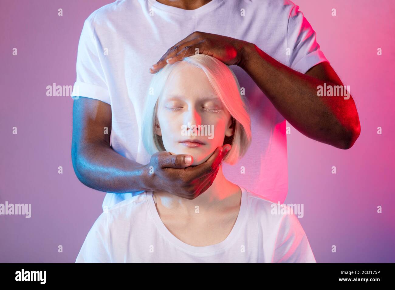 man' hands are on woman's head. Guy is massaging the patient's head ...