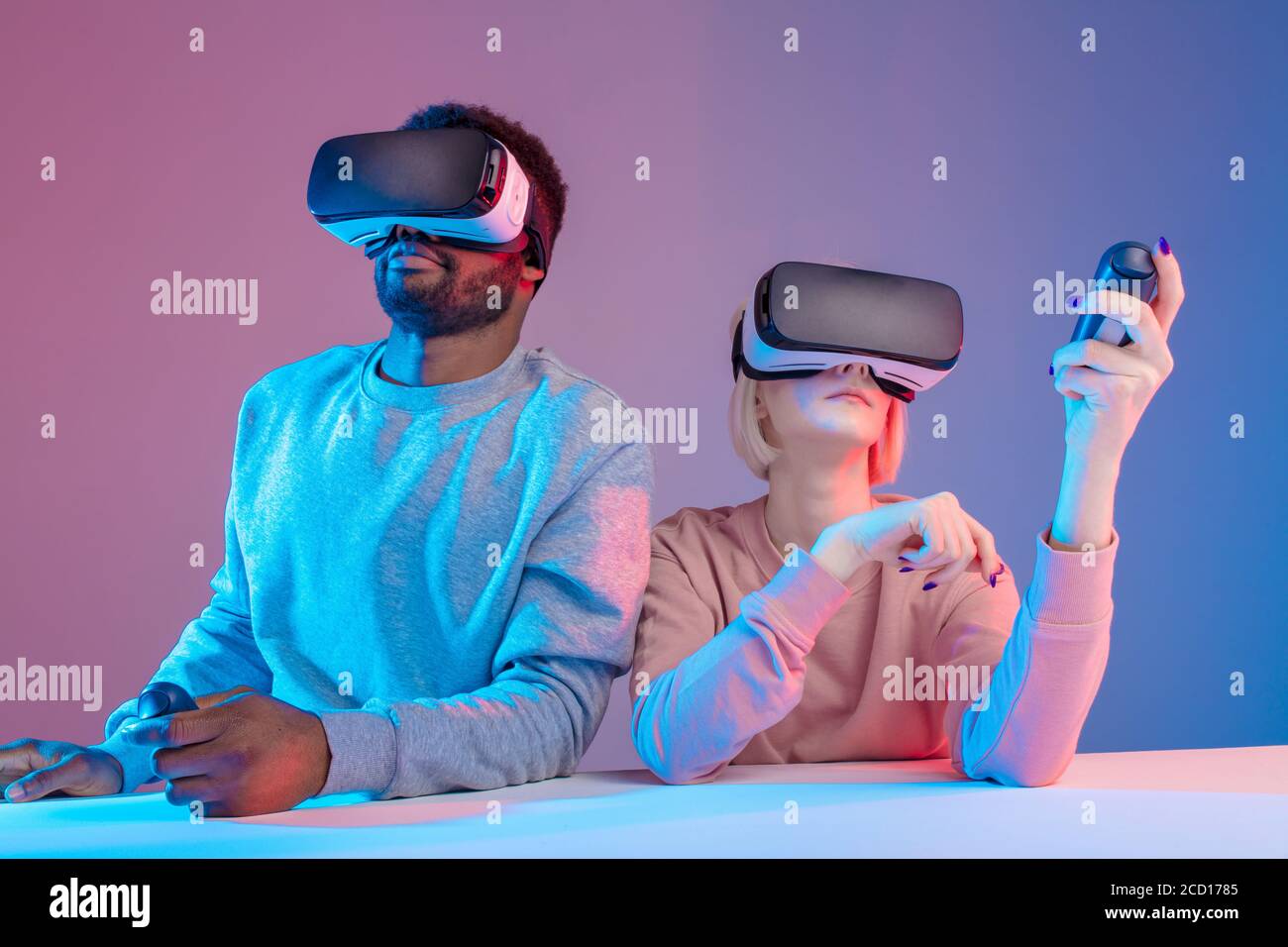 interactive computer-generated experience. young couple interacting ...