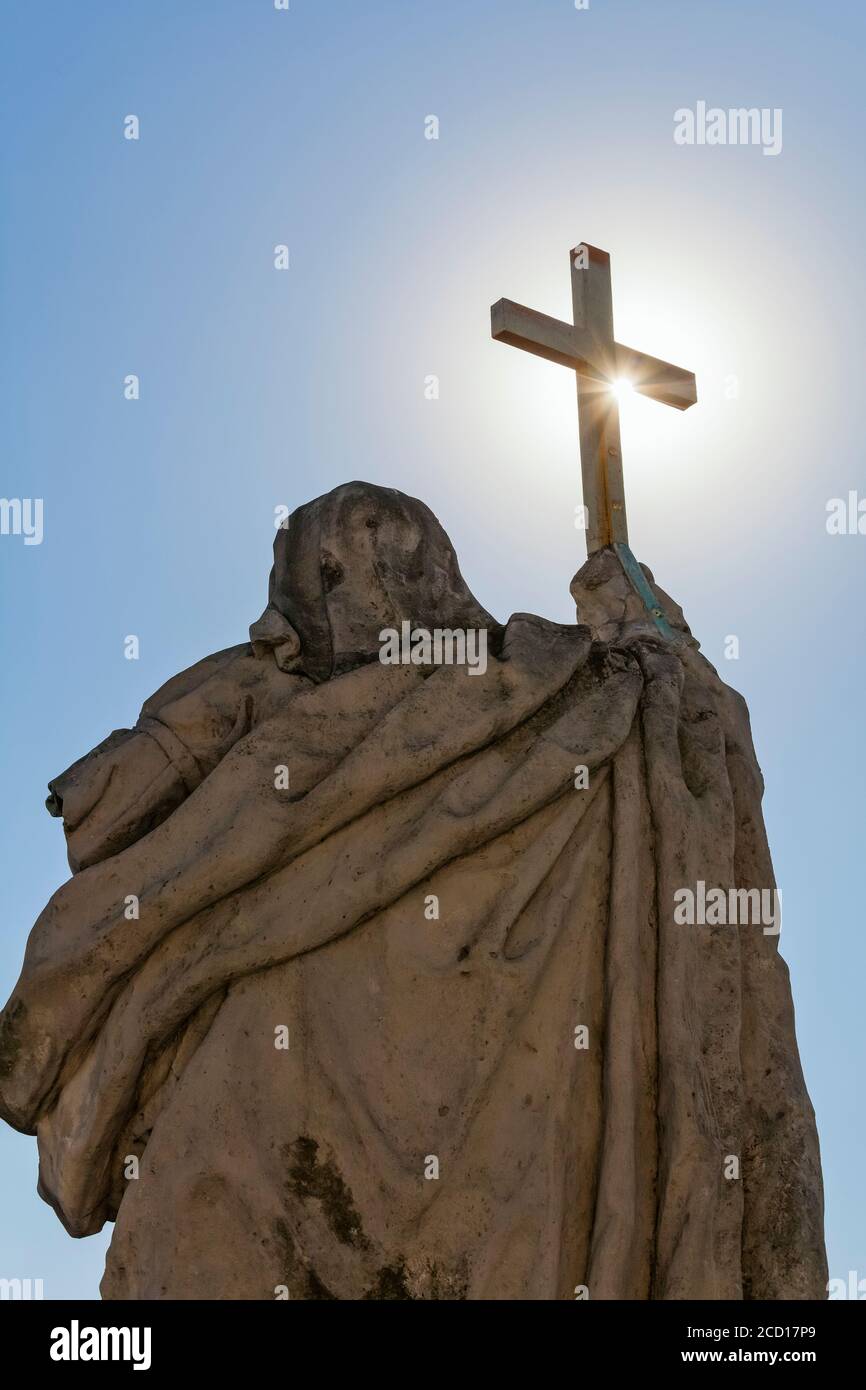 Statue of figure holding crucifix, representing Theology, on the ...