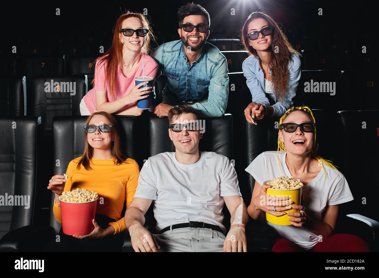 Laughing sitting in cinema watch film hi-res stock photography and ...