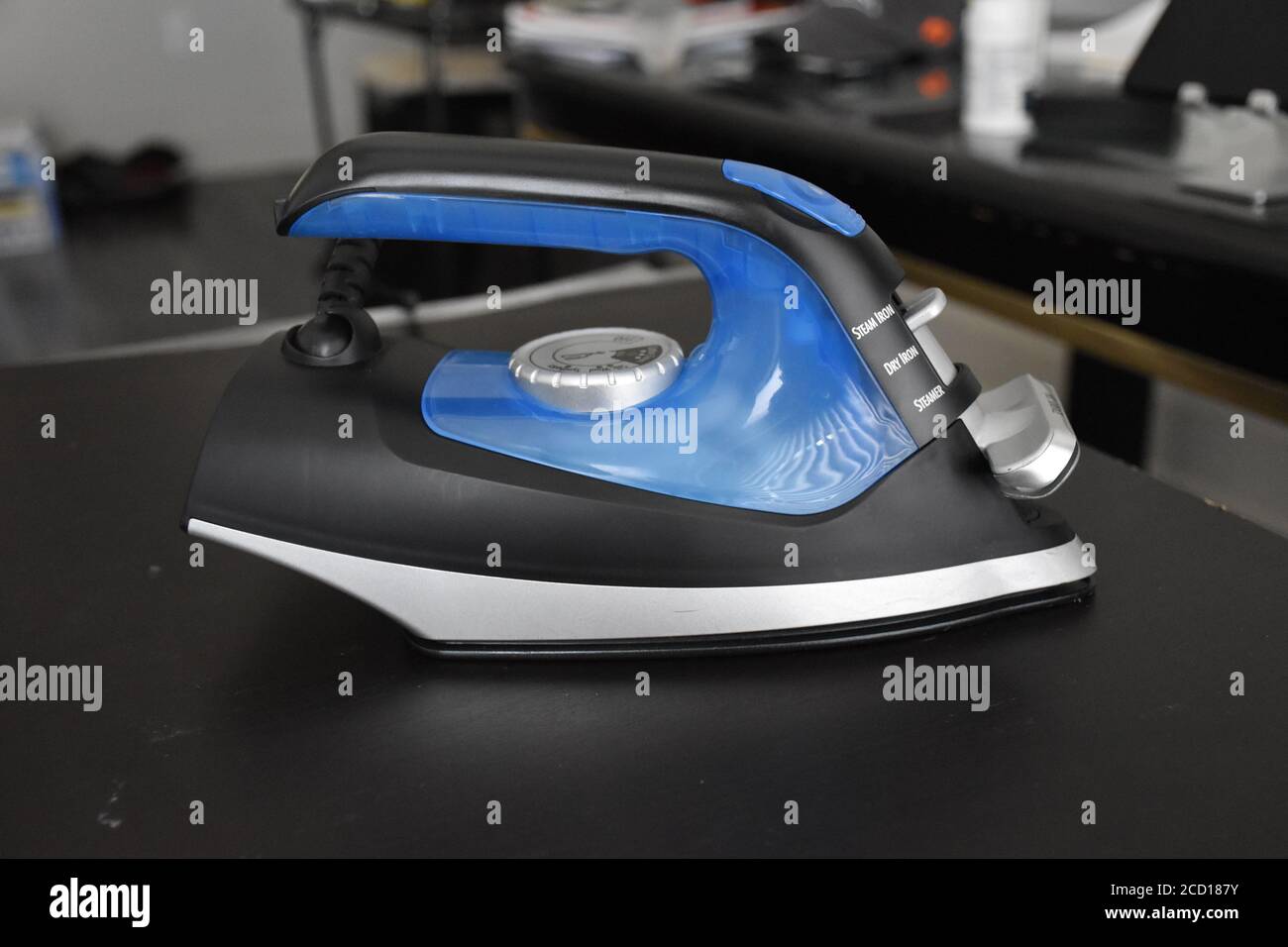 Iron box isolated against a blur background Stock Photo - Alamy