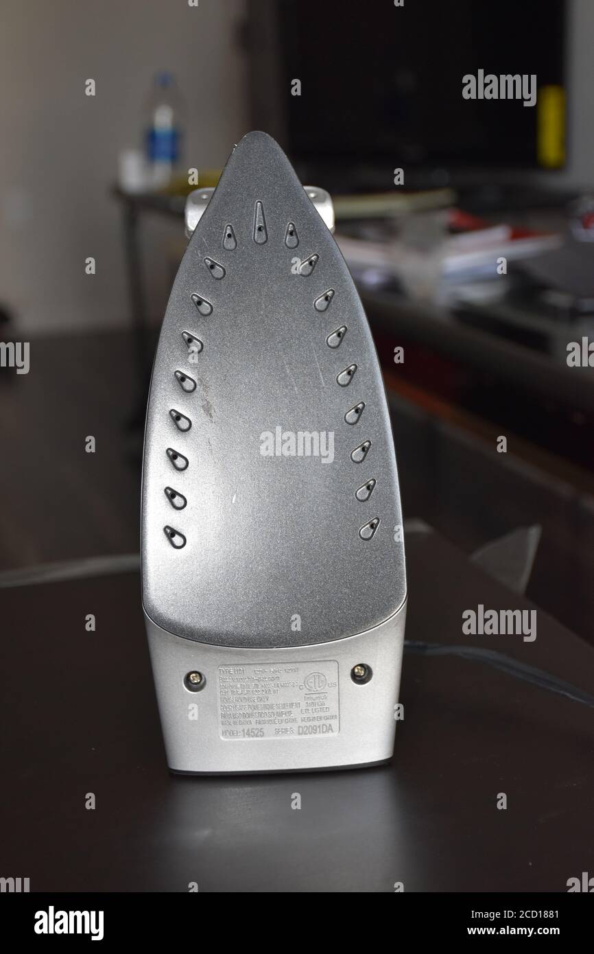 Iron box isolated against a blur background Stock Photo - Alamy