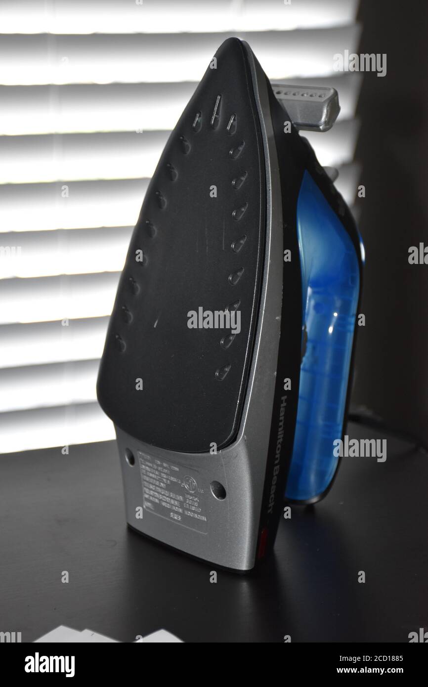 Iron box isolated against a blur background Stock Photo - Alamy