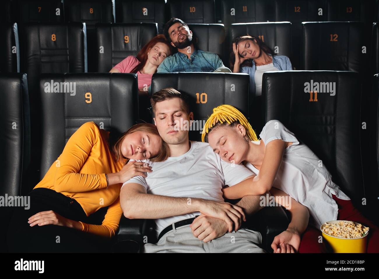 tired sleeping audience doesn't like the plot of film,close up photo ...