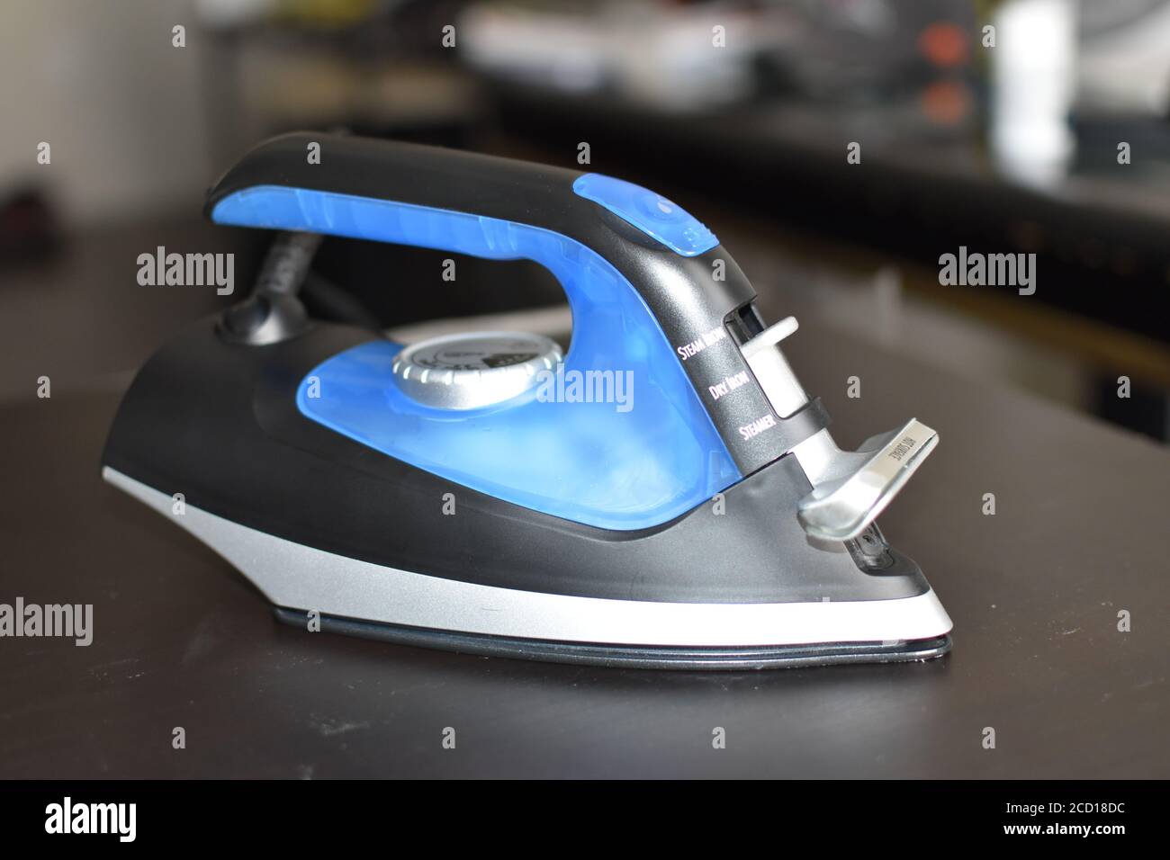 Iron box isolated against a blur background Stock Photo - Alamy