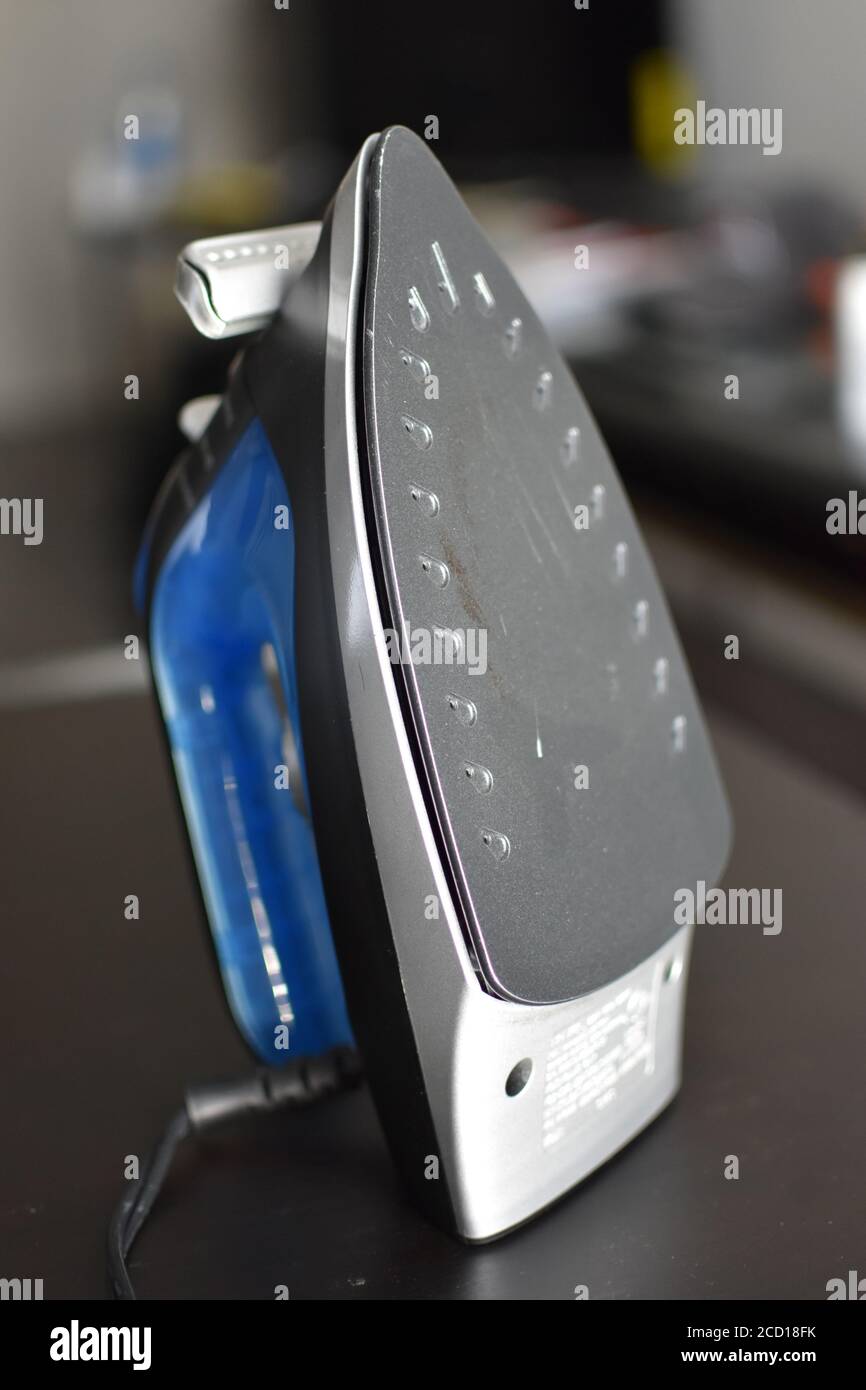 Iron box isolated against a blur background Stock Photo - Alamy