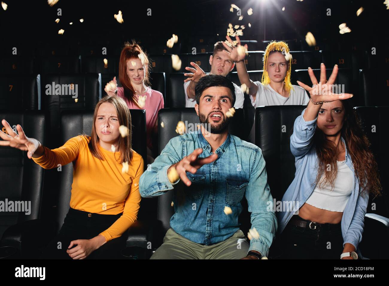 Throwing popcorn in theater hi-res stock photography and images - Alamy