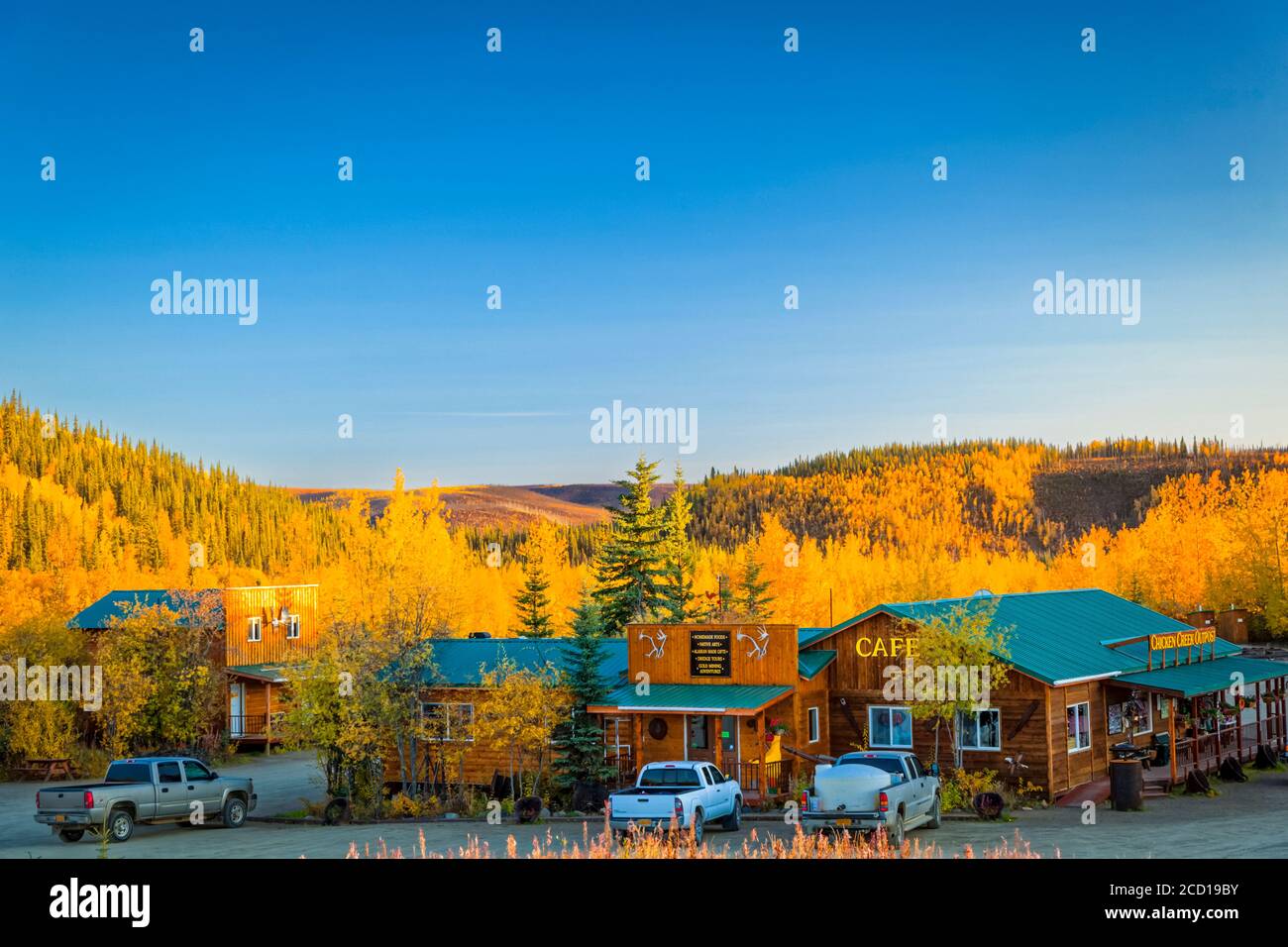 Log buildings of Chicken Creek Outpost, surround with fall coloured ...