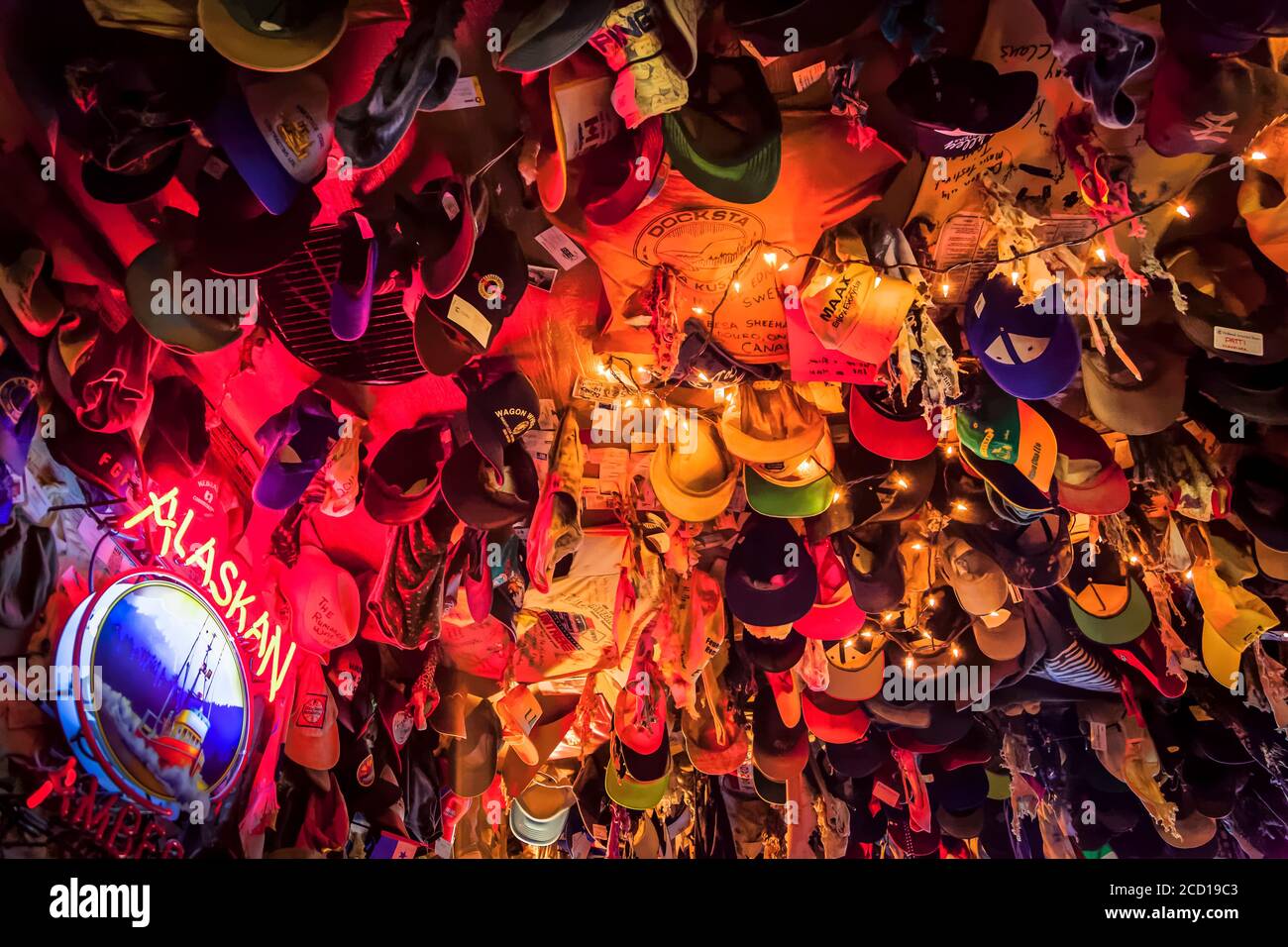 Interior of Chicken Creek Saloon, decorated with baseball caps ...