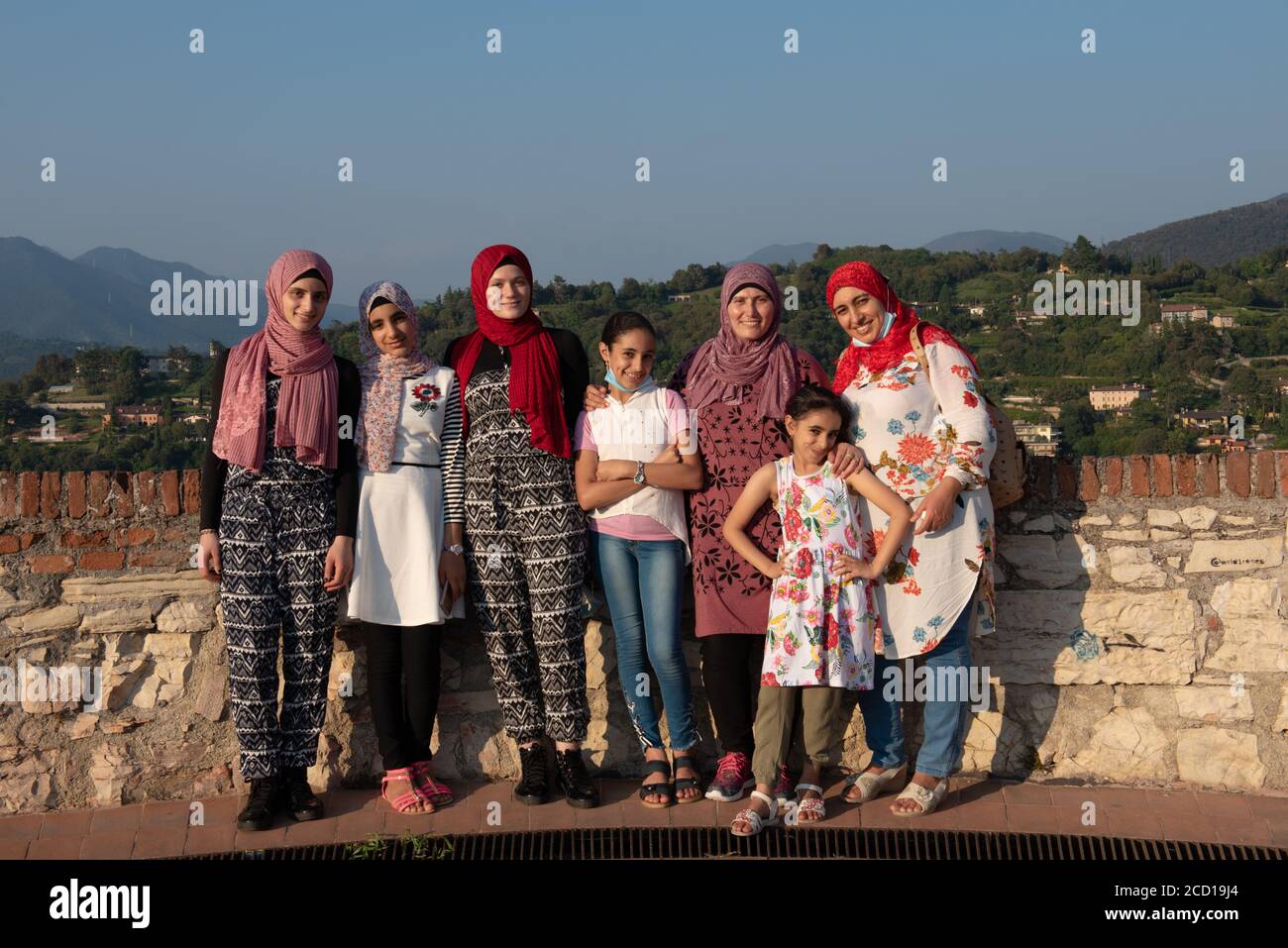 Egyptian women pose in front of camera on the roof terrace with aerial ...