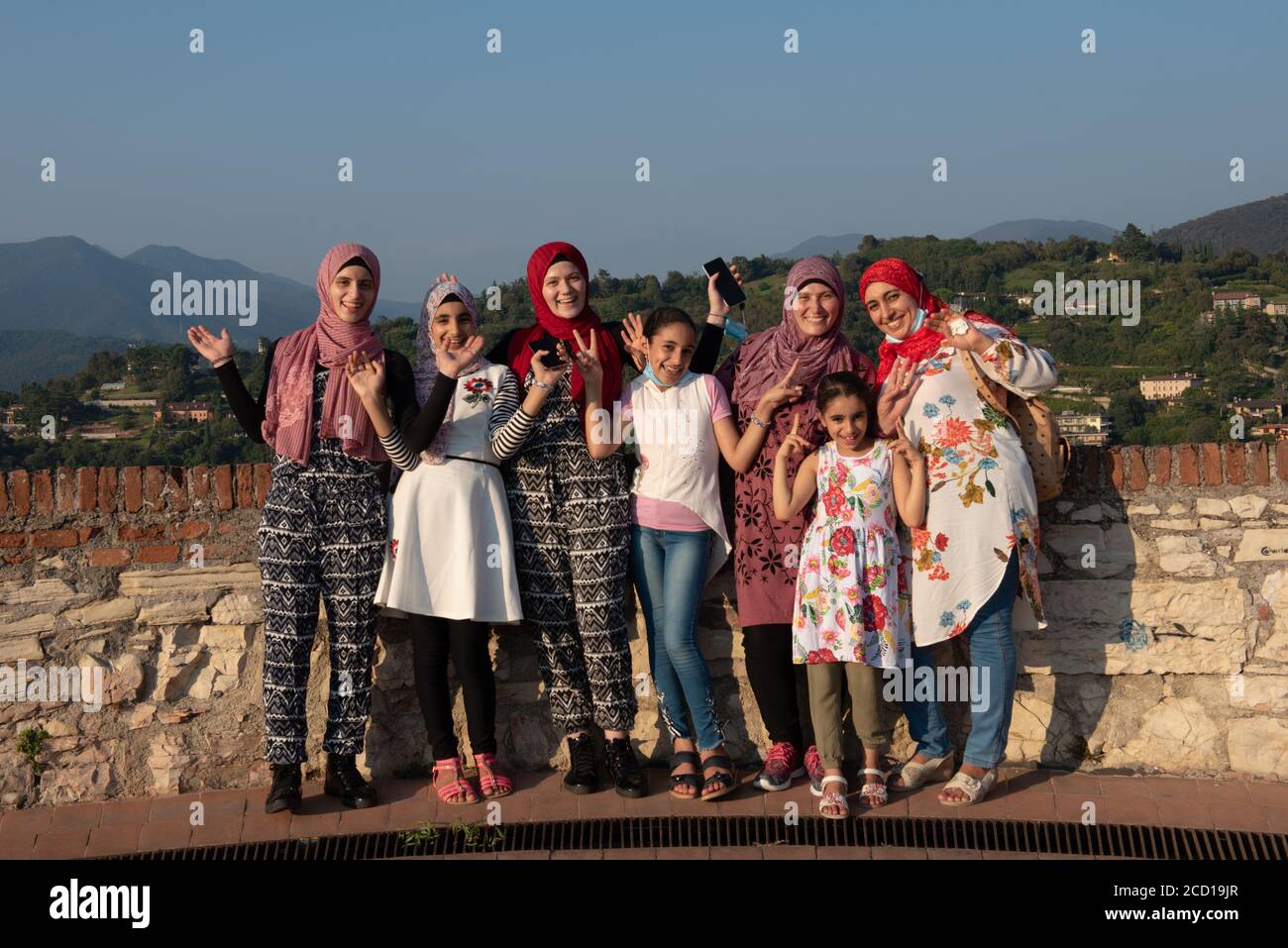 Egyptian women pose in front of camera on the roof terrace with aerial ...