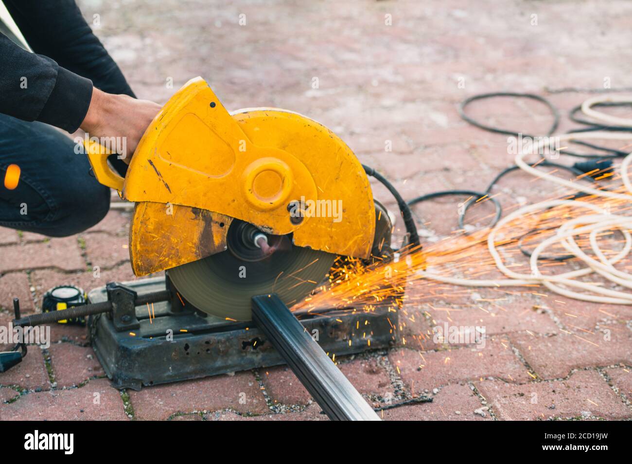 Miter saw. Cutting of iron profile. Shavings Stock Photo - Alamy