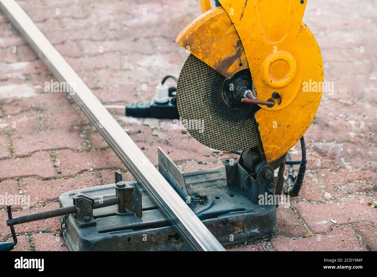 Miter saw. Cutting of iron profile. Shavings Stock Photo - Alamy