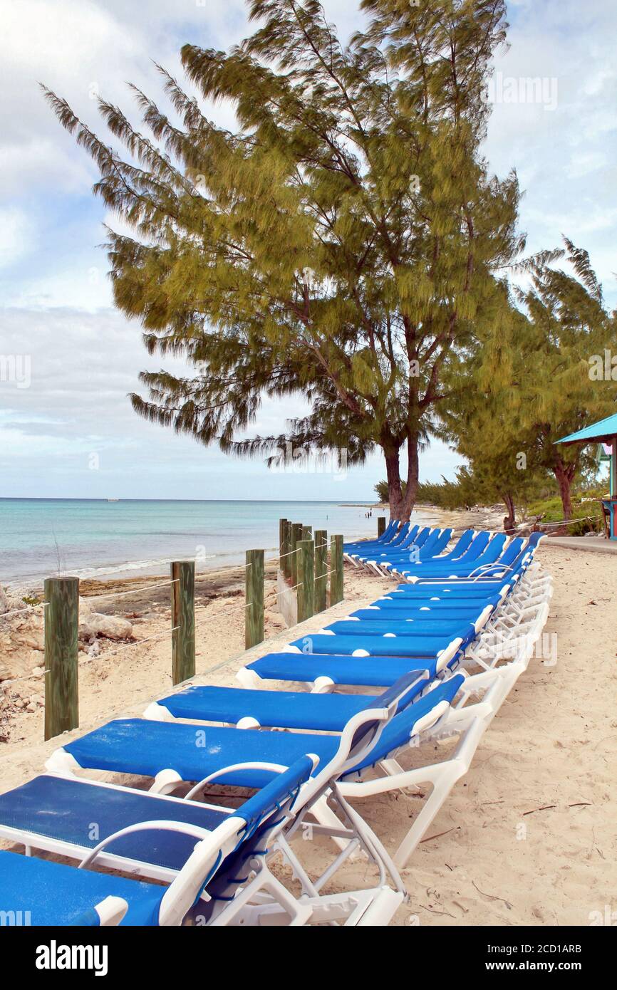 Lounge chairs on the beach Stock Photo - Alamy