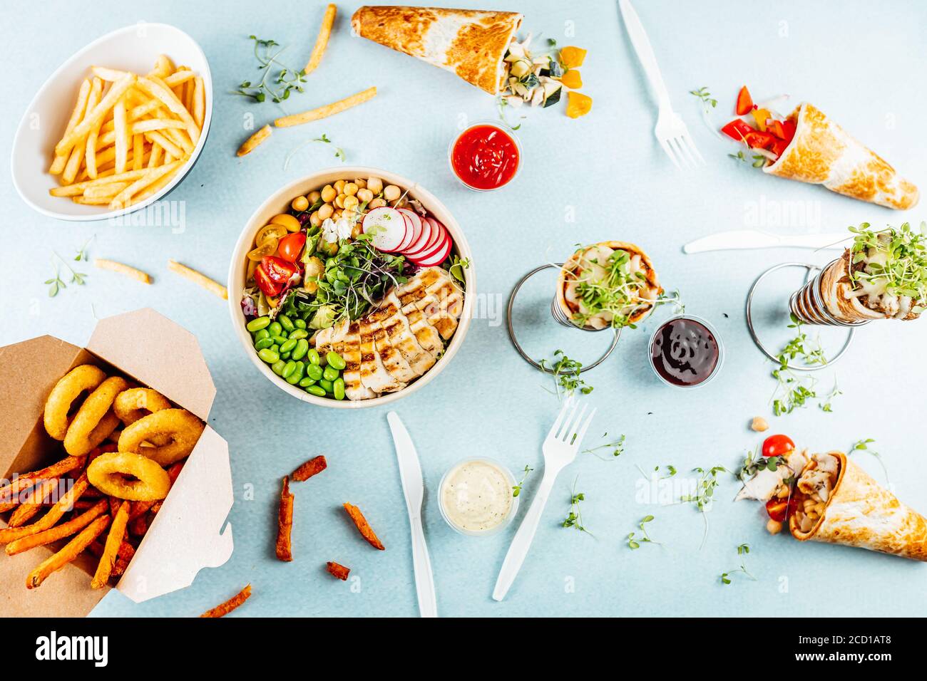 Flat lay of pizza cones and snack boxes Stock Photo - Alamy