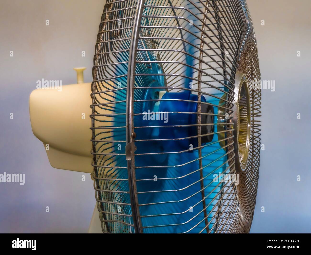 Old and slightly rusty vintage 1980s room fan, with distinctive turning ...