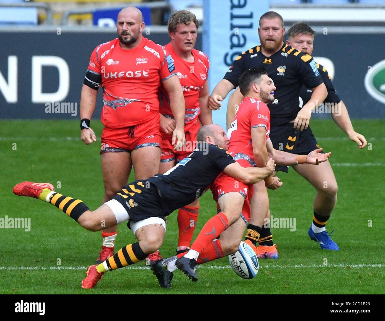 Wasps' Dan Robson tackles Sale Sharks' Will Cliff (right) during the ...