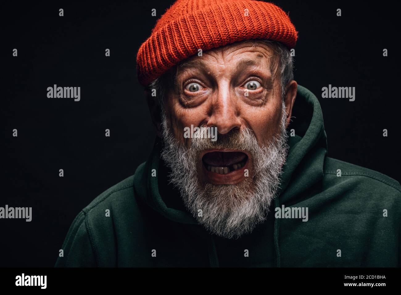 Stunned scared bearded old-aged male model open mouth with one missing ...